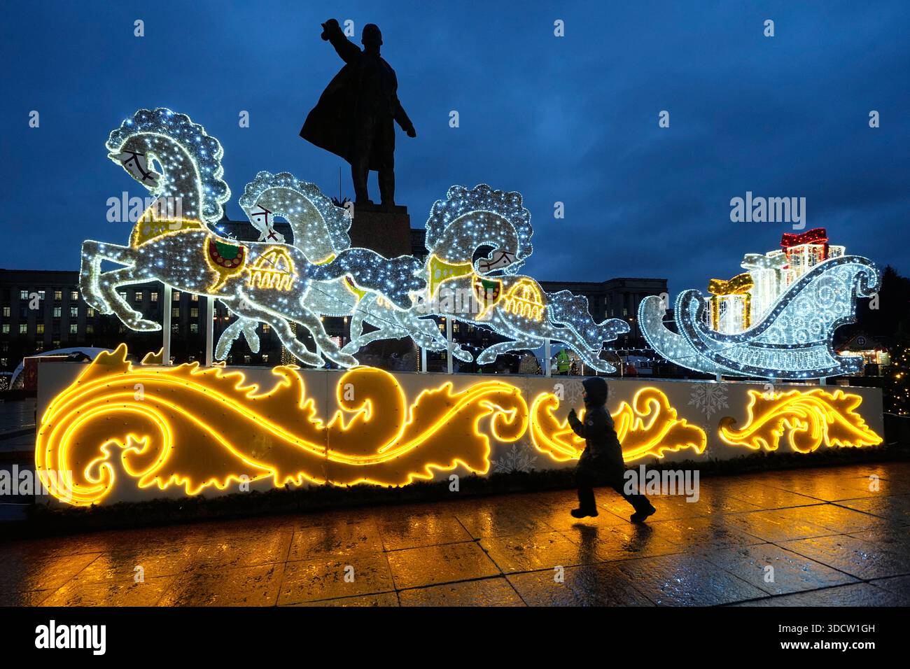 A boy runs at a Christmas fair opened prior to Christmas and New Year ...