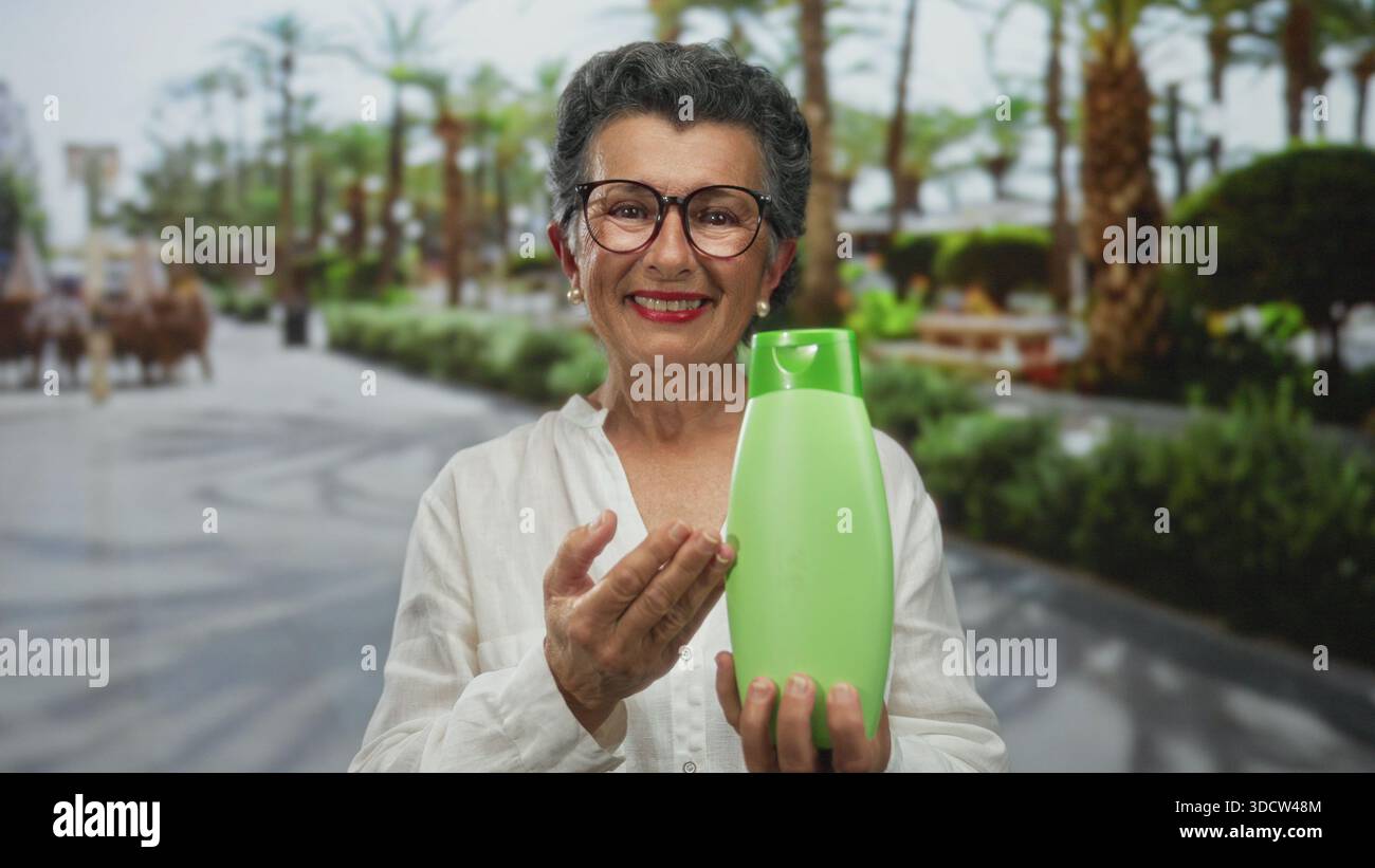 Senior woman holding shampoo hi-res stock photography and images - Alamy