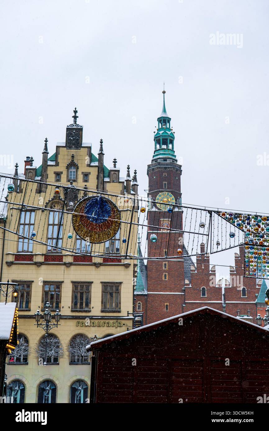 Wroclaw Rynek in winter shows ornate facades and the Town Hall tower ...