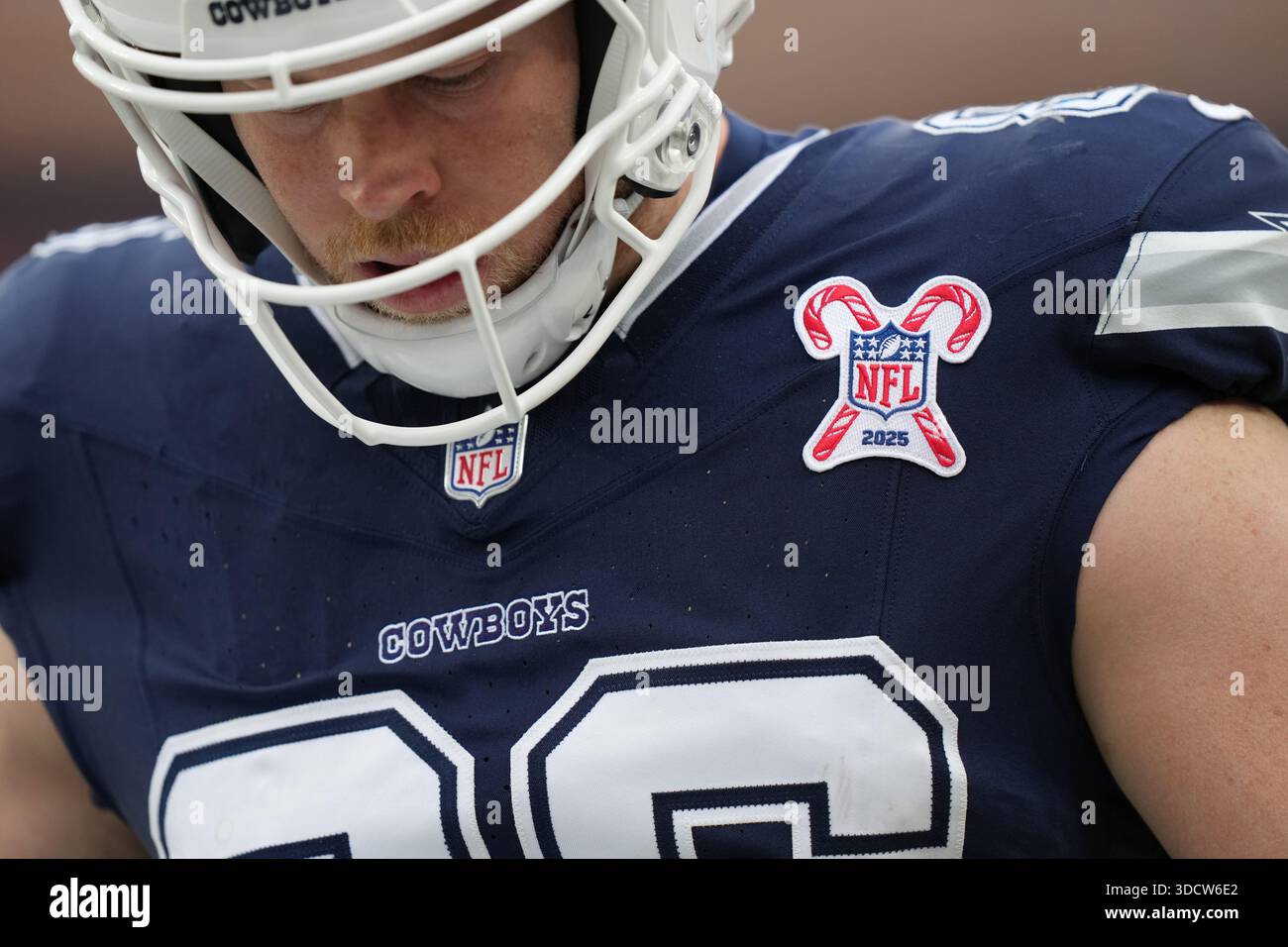 A candy cane logo is seen on the jersey of Dallas Cowboys tight end ...