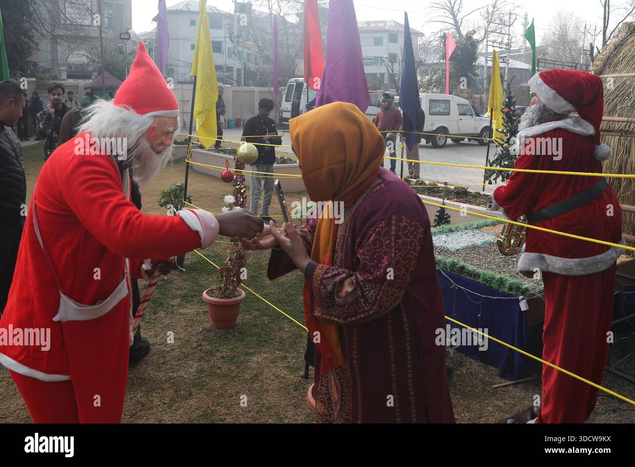 SRINAGAR, INDIA - DECEMBER 25: A man dressed as a Santa Claus outside ...