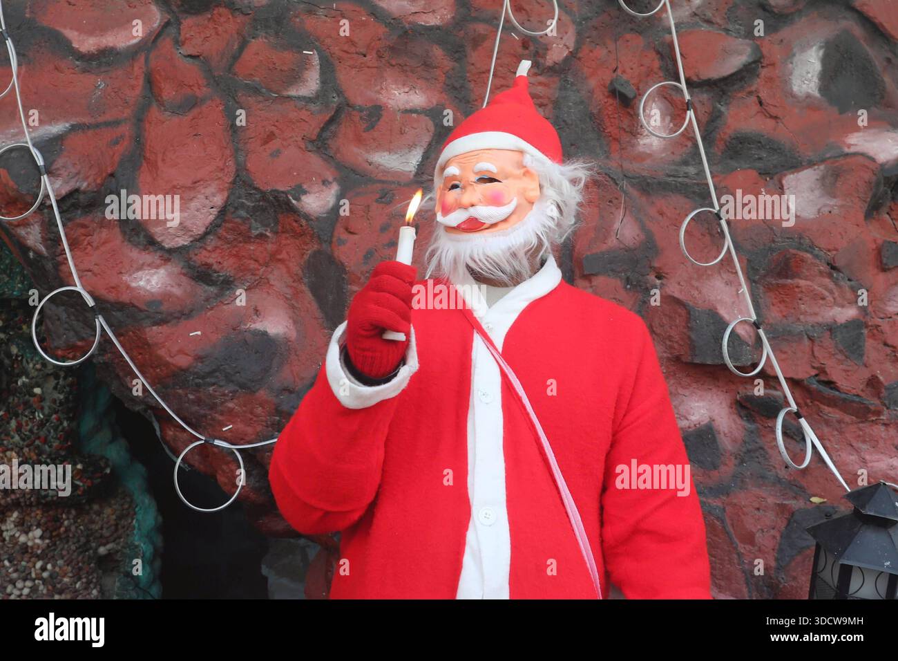 SRINAGAR, INDIA - DECEMBER 25: A man dressed as a Santa Claus outside ...