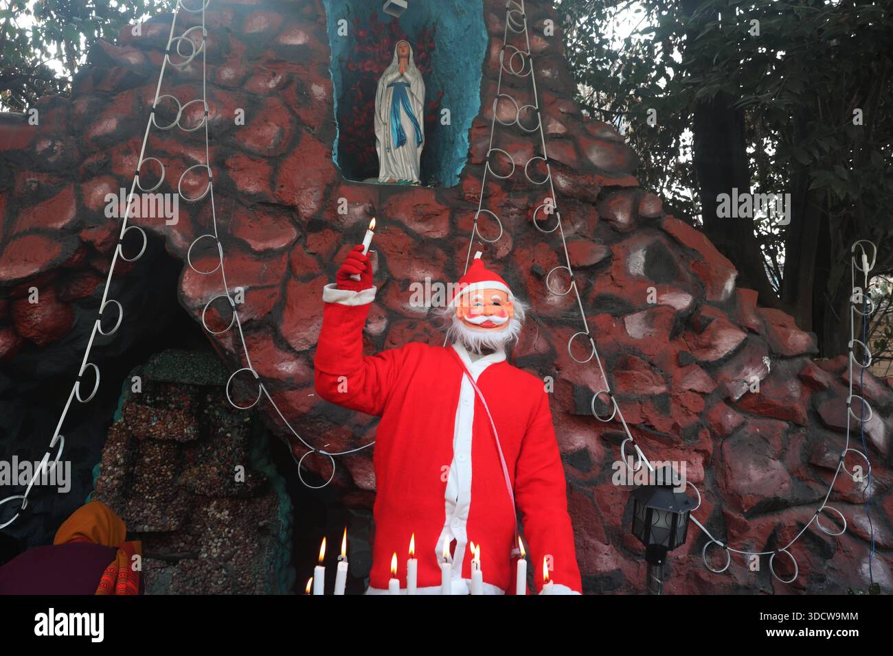 SRINAGAR, INDIA - DECEMBER 25: A man dressed as a Santa Claus outside ...