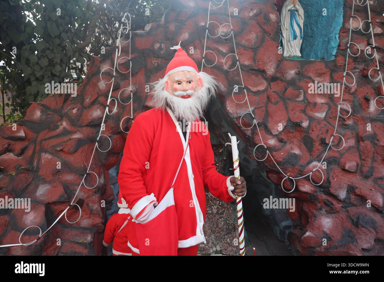 SRINAGAR, INDIA - DECEMBER 25: A man dressed as a Santa Claus outside ...
