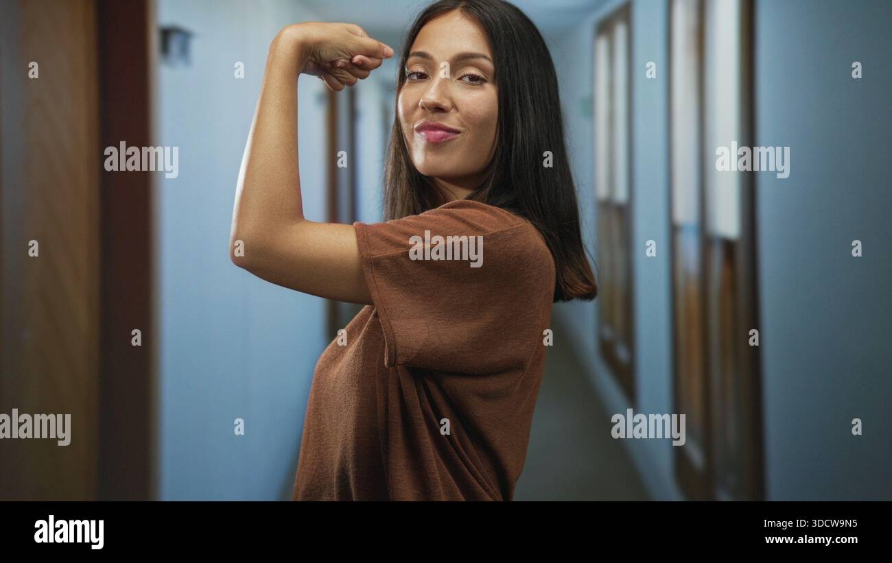 Woman flexing bicep in hotel hi-res stock photography and images - Alamy
