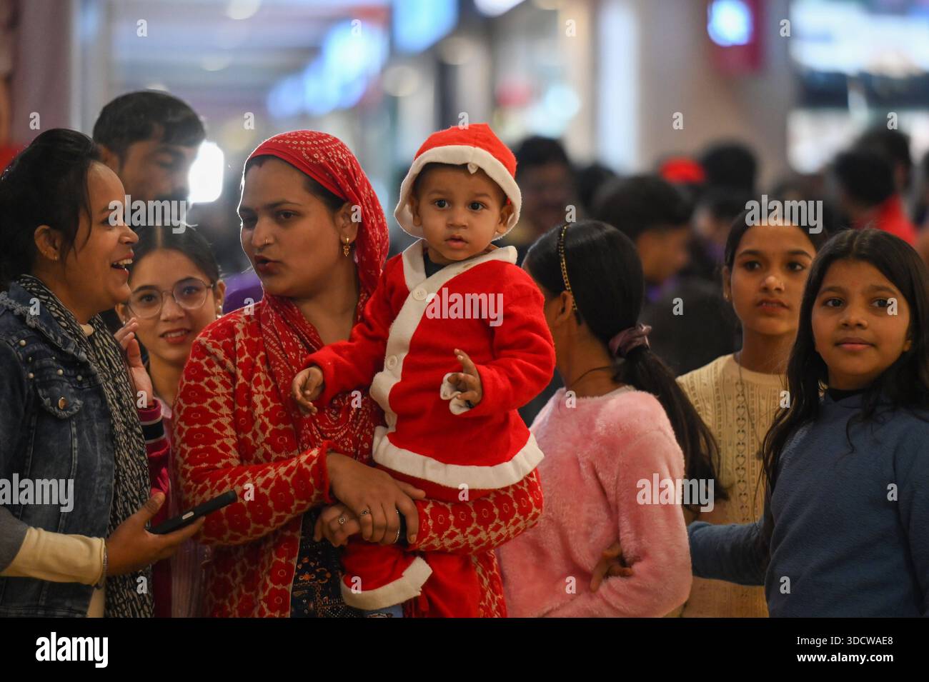 NOIDA, INDIA - DECEMBER 25: Children dressed as Santa Claus at GIP Mall ...