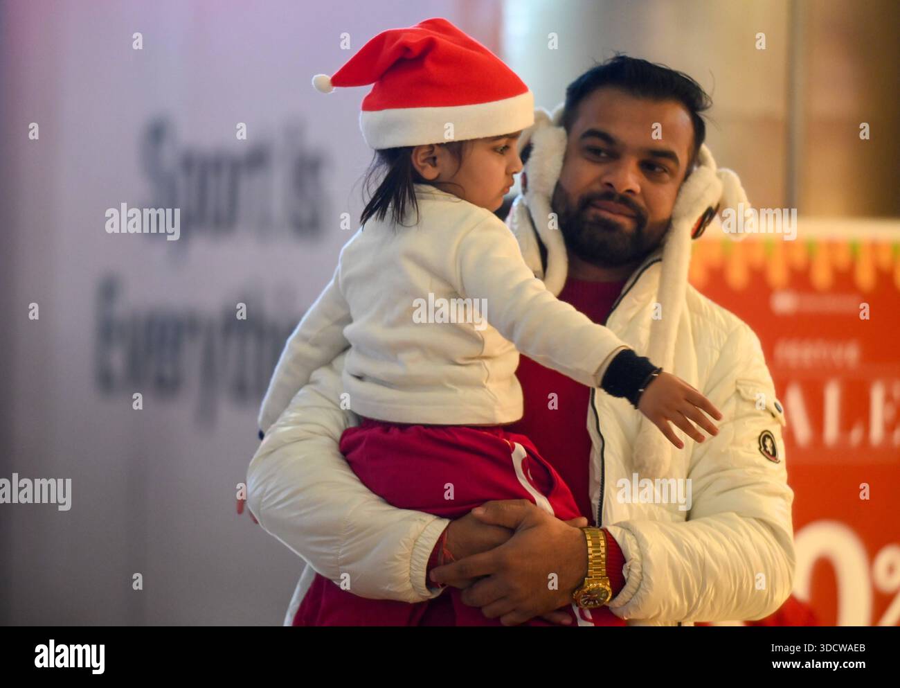 NOIDA, INDIA - DECEMBER 25: Children dressed as Santa Claus at GIP Mall ...