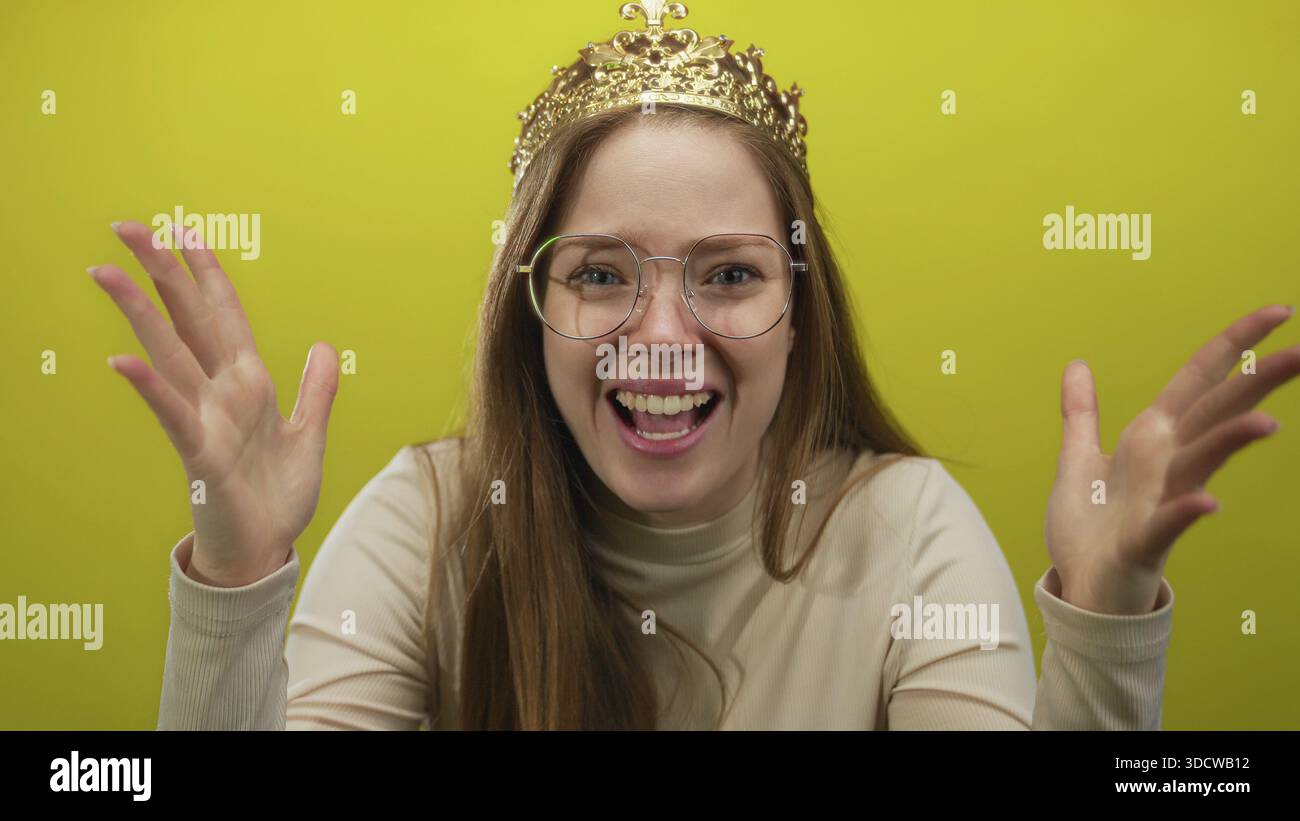 Woman wearing crown glasses raises hi-res stock photography and images ...