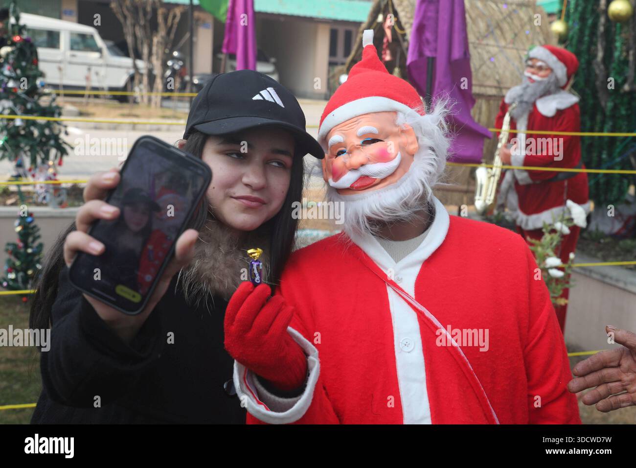 SRINAGAR, INDIA - DECEMBER 25: A man dressed as a Santa Claus outside ...