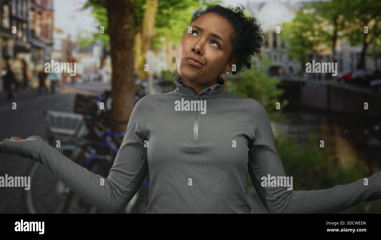 Woman shrugs outstretched hands hi-res stock photography and images - Alamy
