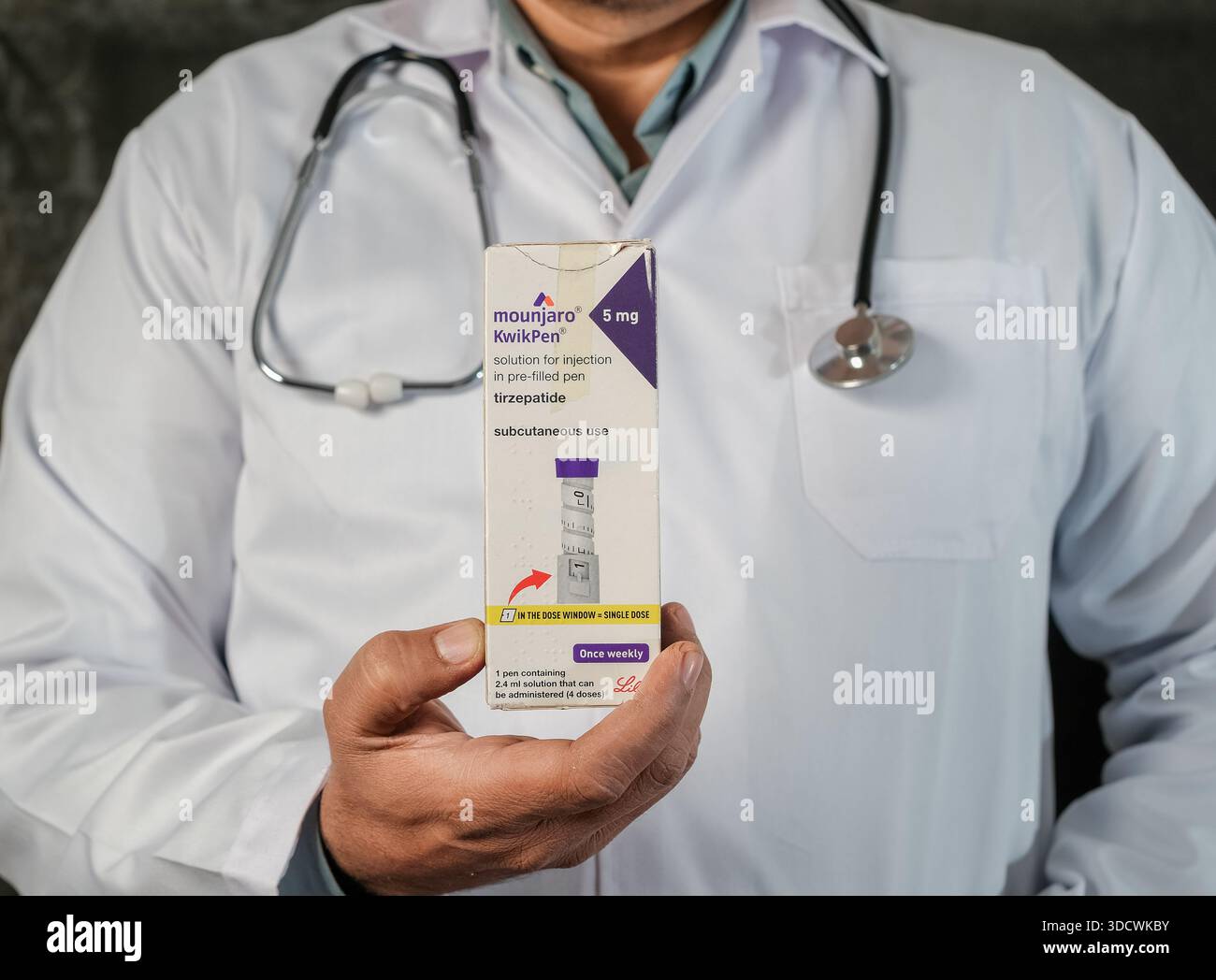 Medical doctor holding a box of Mounjaro KwikPen five milligram for ...