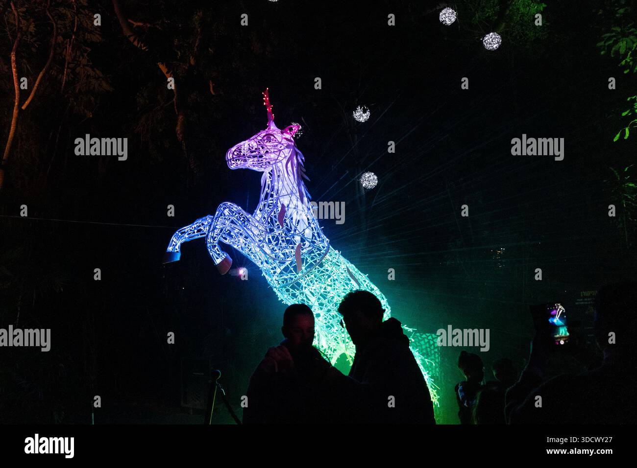 People attend LUMAGICA Holidays light show at Yarkon Park in Tel Aviv ...
