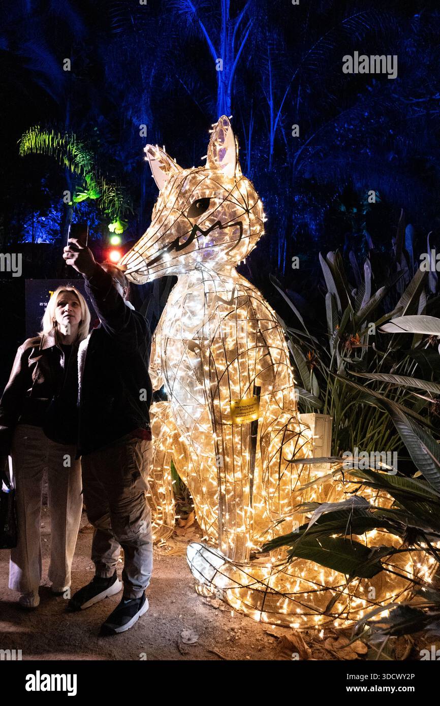 People attend LUMAGICA Holidays light show at Yarkon Park in Tel Aviv ...