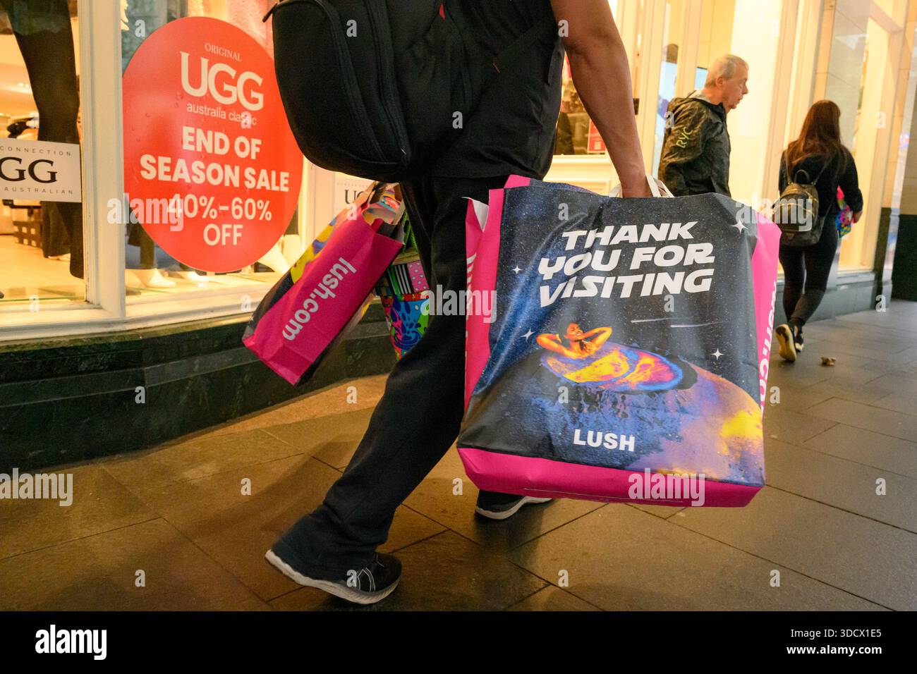 Shoppers carry shopping bags during Boxing Day sales at Pitt Street ...