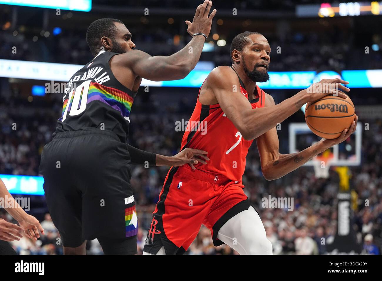 Houston Rockets forward Kevin Durant (7) and Denver Nuggets guard Tim ...