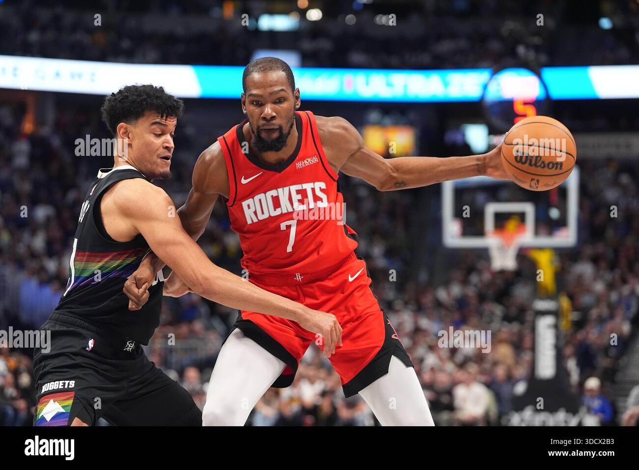 Houston Rockets forward Kevin Durant (7) and Denver Nuggets forward ...