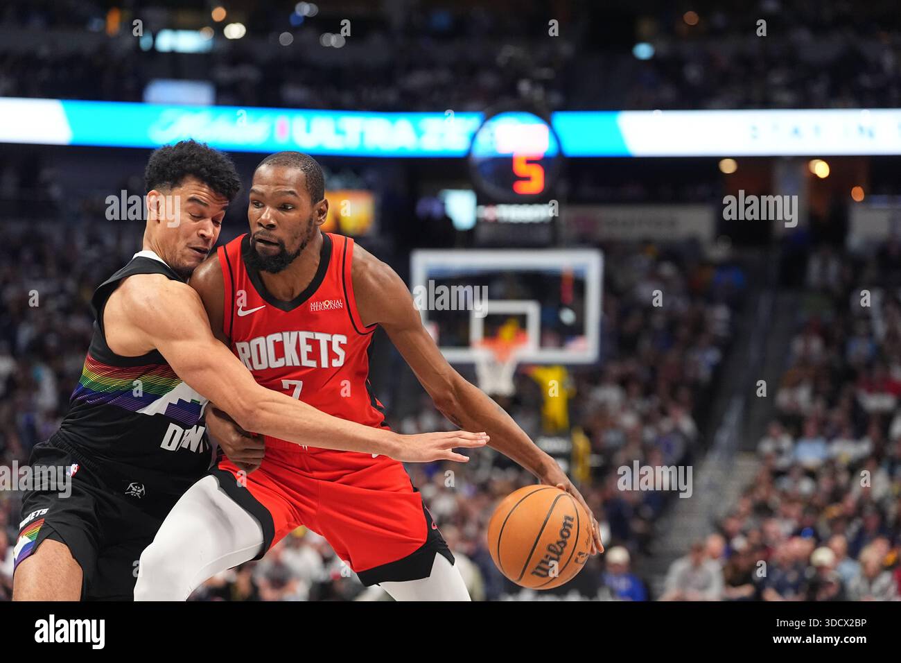 Houston Rockets forward Kevin Durant (7) and Denver Nuggets forward ...
