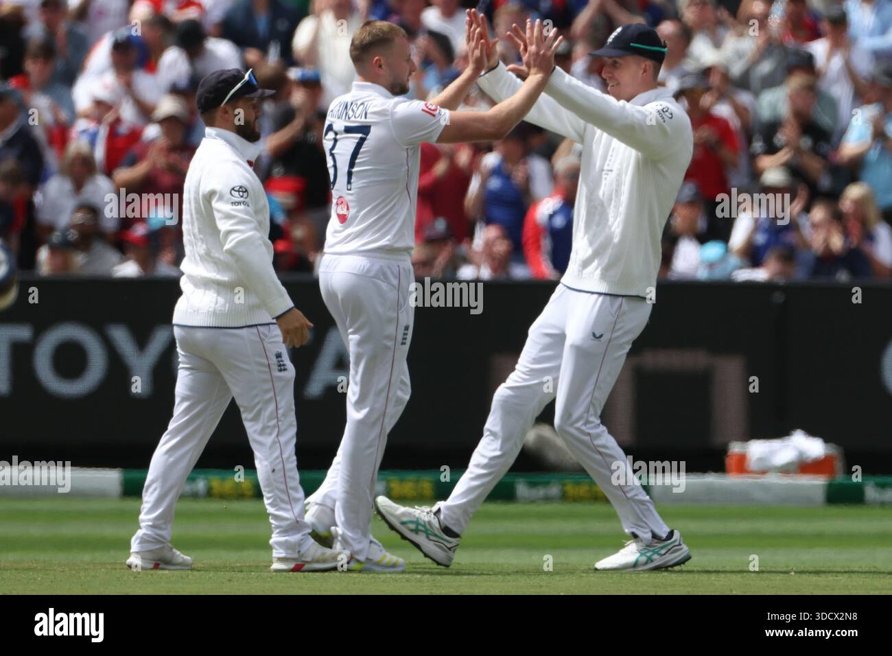 England's Gus Atkinson, center, celebrates with teammates after bowling ...