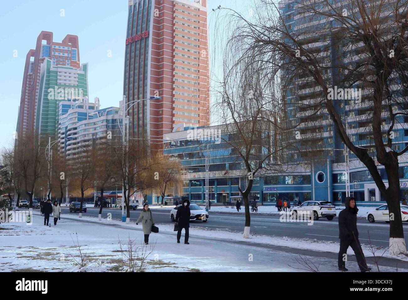 People walk in the Mirae Scientist Street, Pyongyang, North Korea, on ...