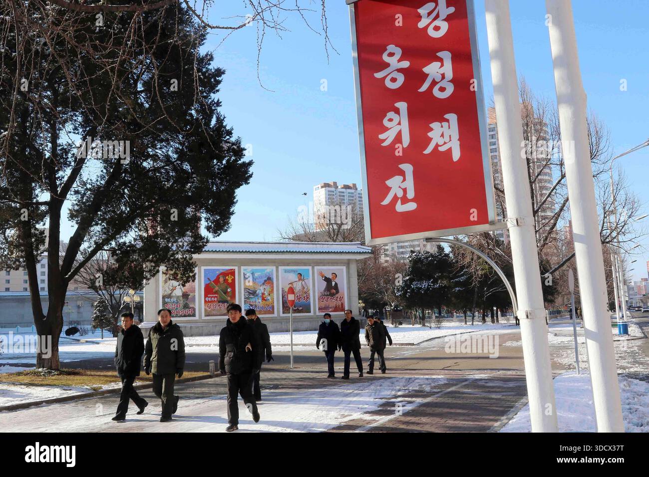 People walk in the street of the Central District, Pyongyang, North ...