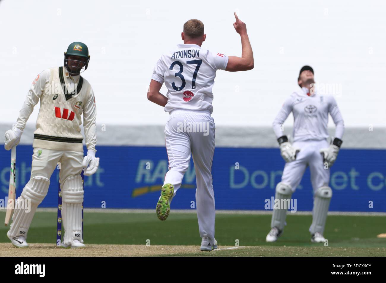 England's Gus Atkinson, center, celebrates the wicket of Australia ...