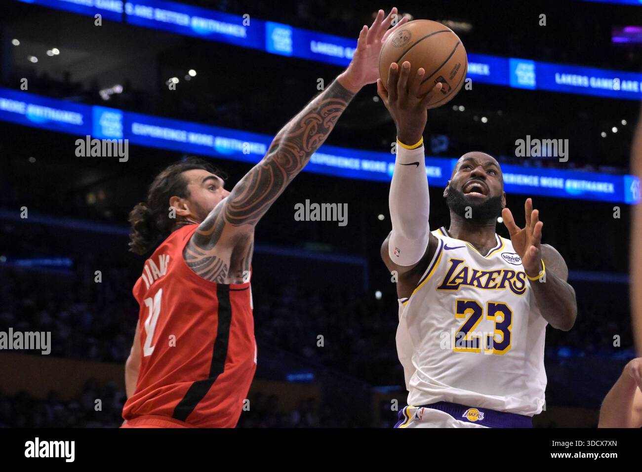 Houston Rockets center Steven Adams, left, blocks a shot by Los Angeles ...