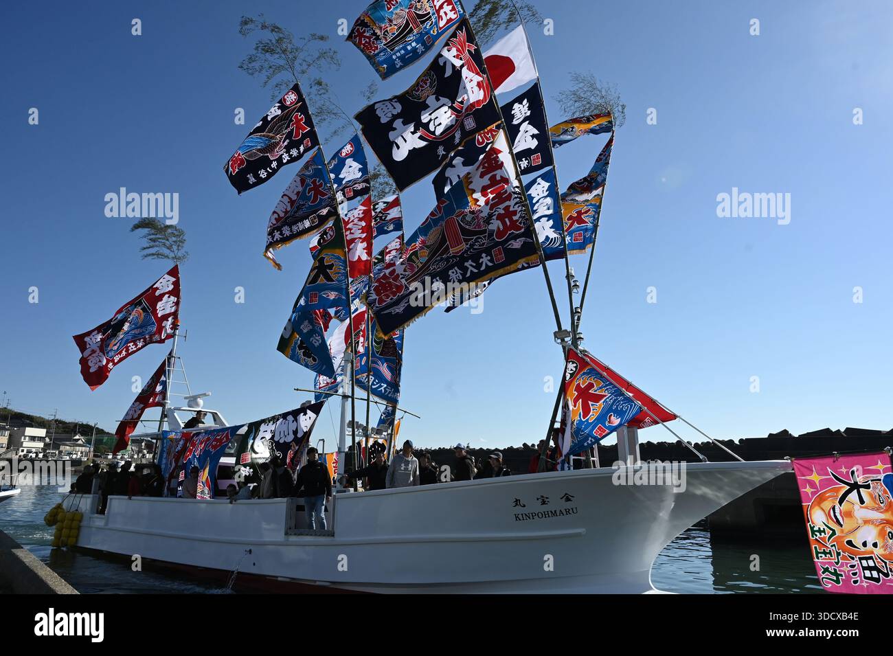 Kinpo-maru, a fishing boat, is decorated with fishing flags for the ...