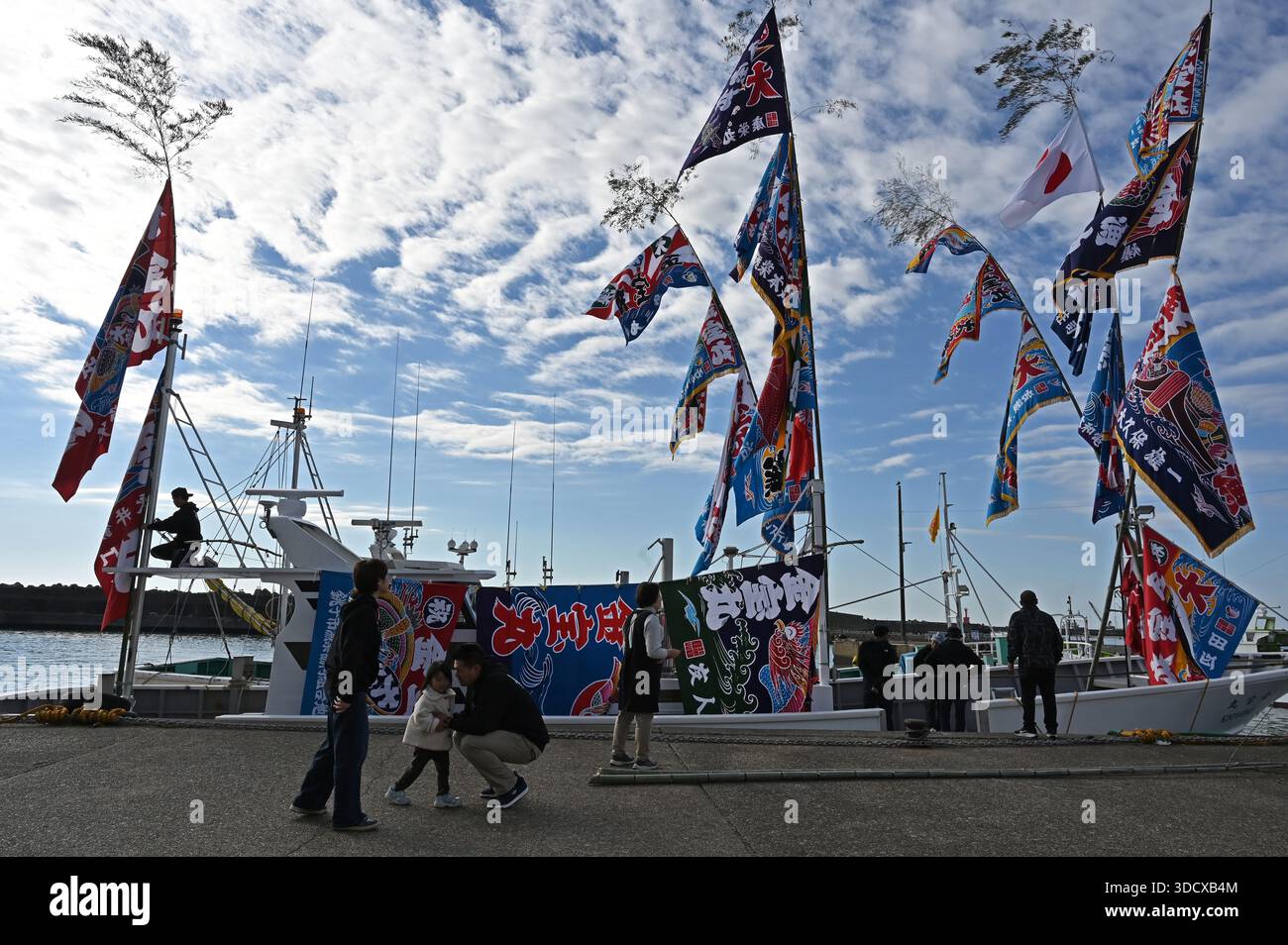 Kinpo-maru, a fishing boat, is decorated with fishing flags for the ...