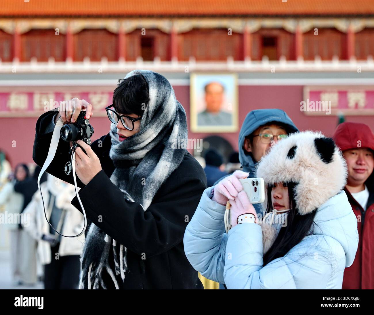 Tourists wear thick clothes visiting Tiananmen Square in Beijing, China ...
