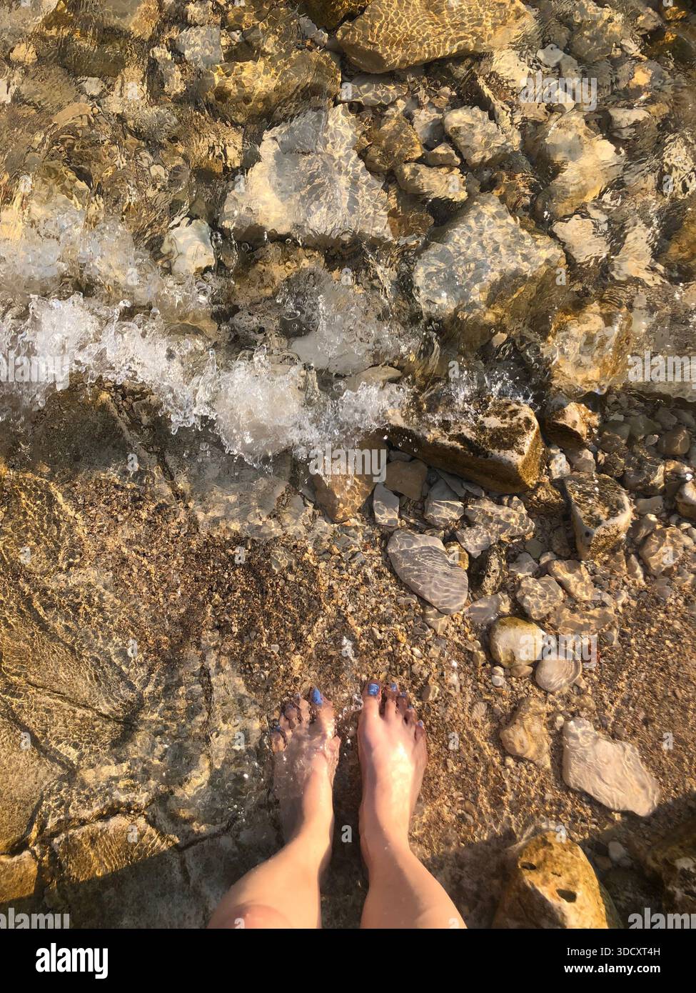 Female feet in the shallow Stock Photo - Alamy