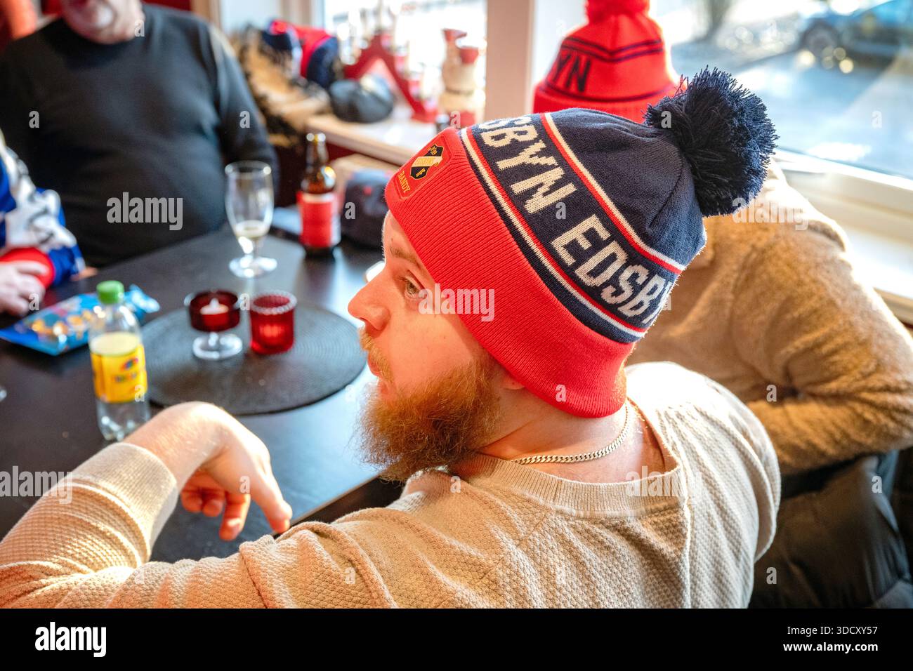 EDSBYN, SWEDEN 20251226 Edsbyns fans warm up in the bar before Friday's ...