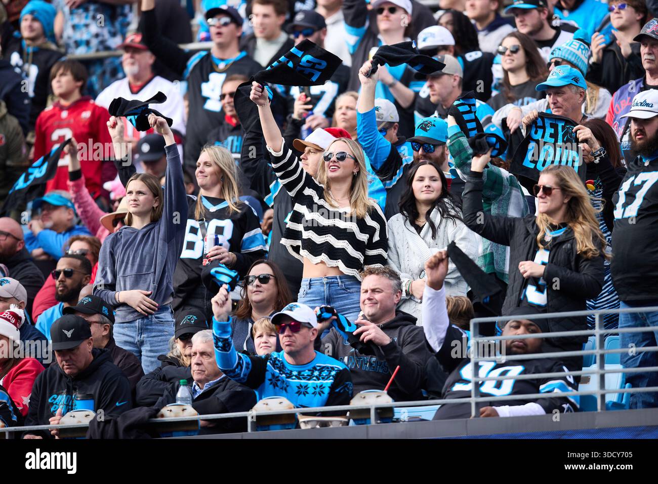 Carolina Panthers fans wave black towels during an NFL football game ...