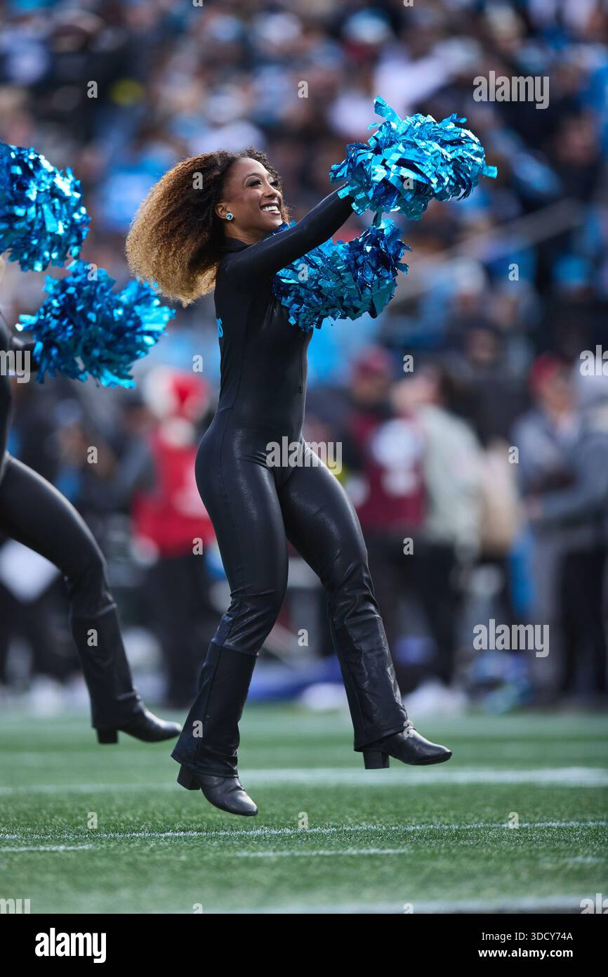 A member of the Top Cats entertains the crowd during an NFL football ...