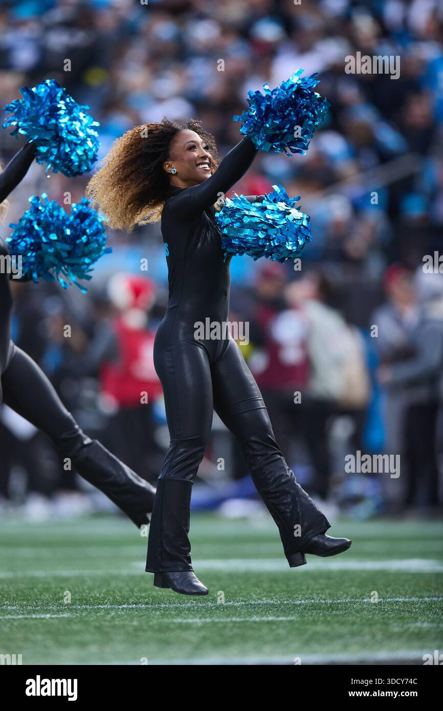 A member of the Top Cats entertains the crowd during an NFL football ...