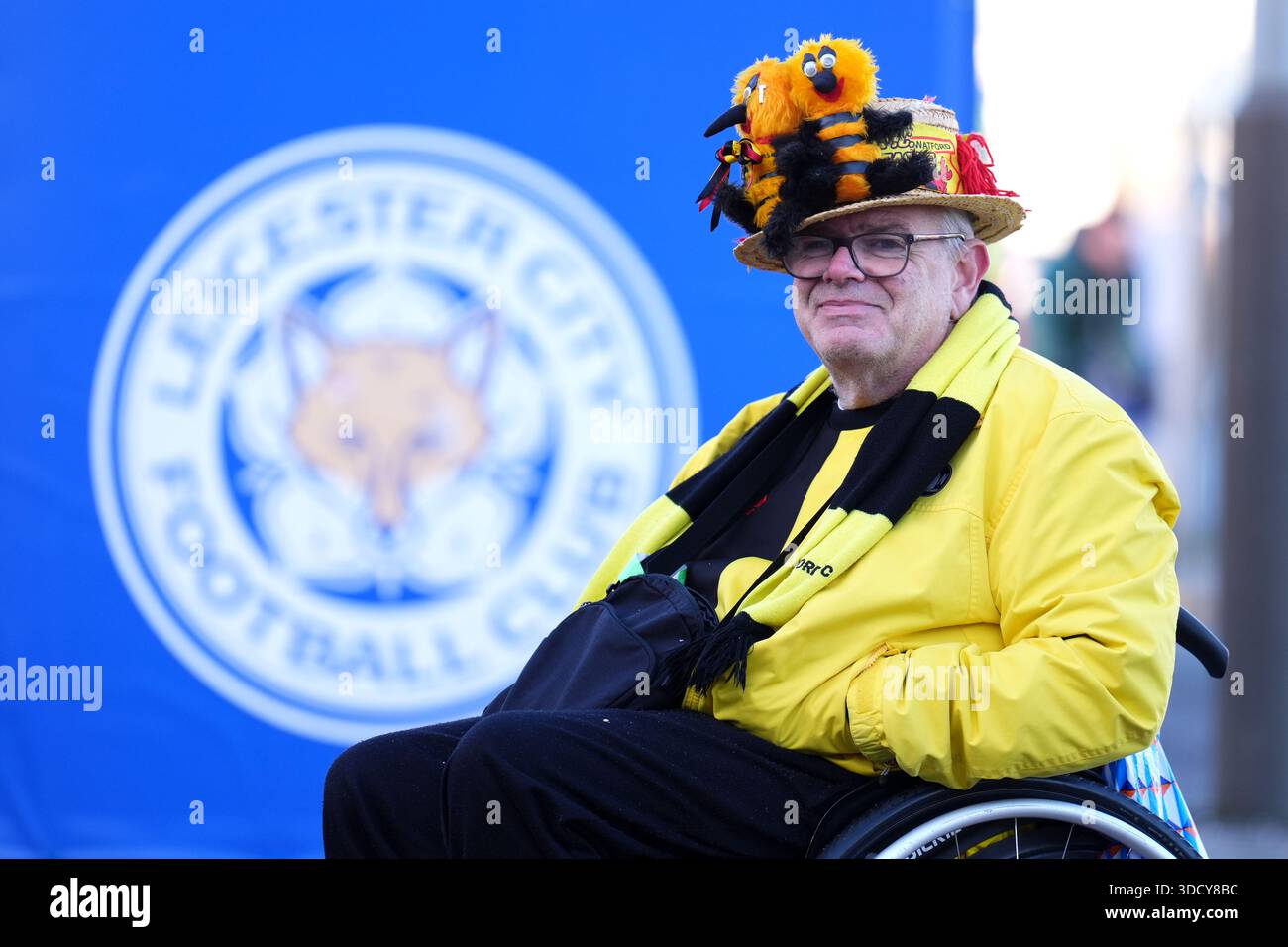 A Watford fan poses for photographs outside the stadium ahead of the ...