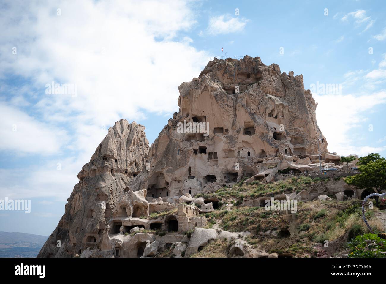Uchisar castle carved into volcanic rock formations, displaying ancient ...