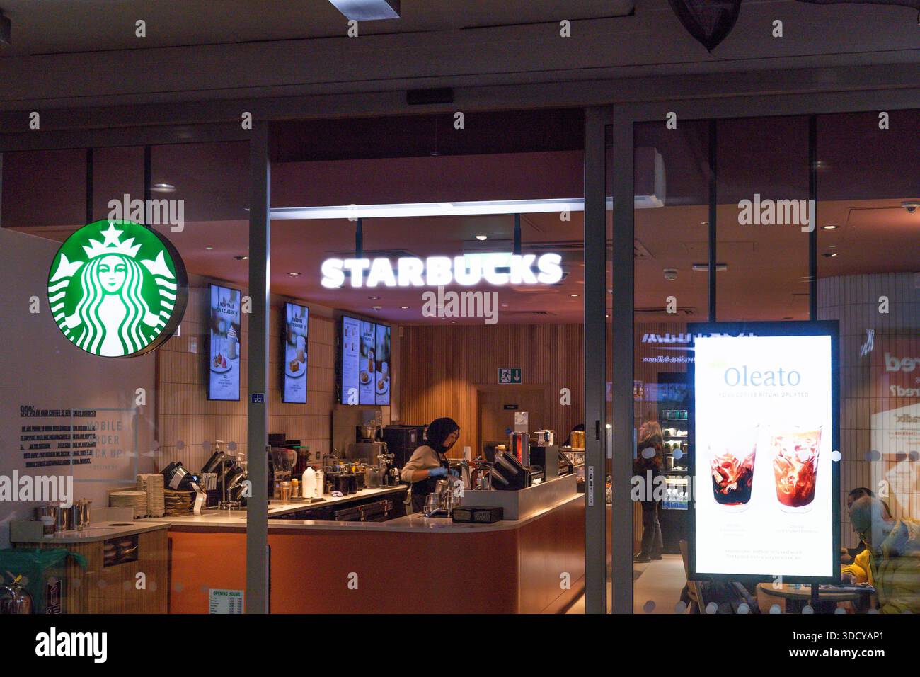 Starbucks coffee shop entrance in a shopping mall. Background of a cafe ...