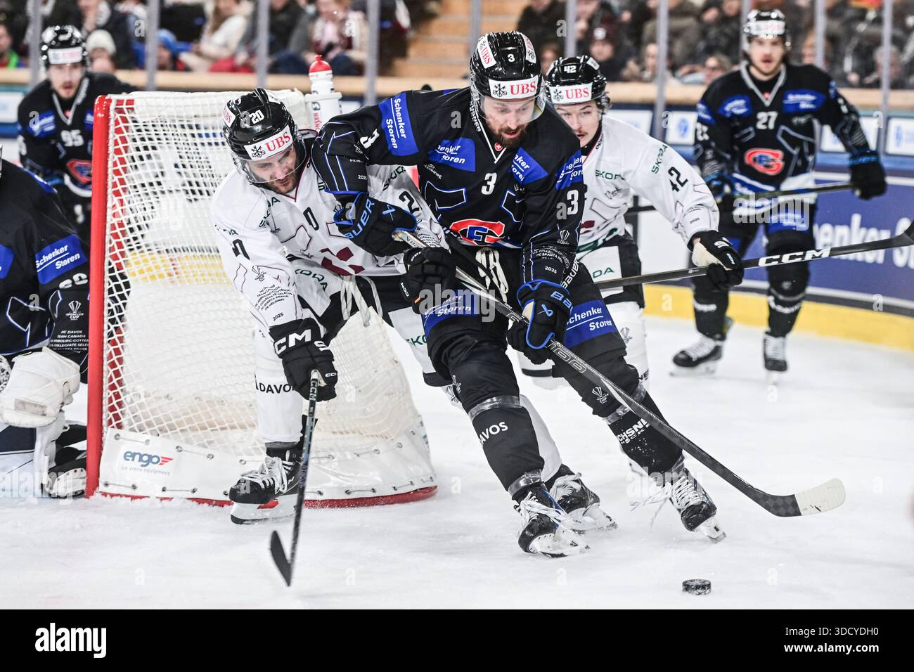 Praha's Jan Eberle, left, and Fribourg's Michael Kapla, centre ...