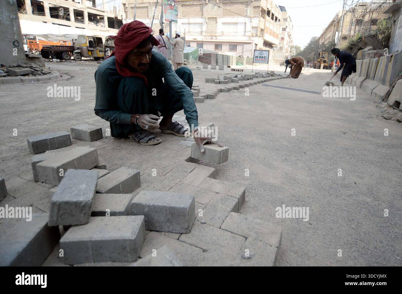 KARACHI, PAKISTAN, DEC 26: Laborers are busy in installation works of ...