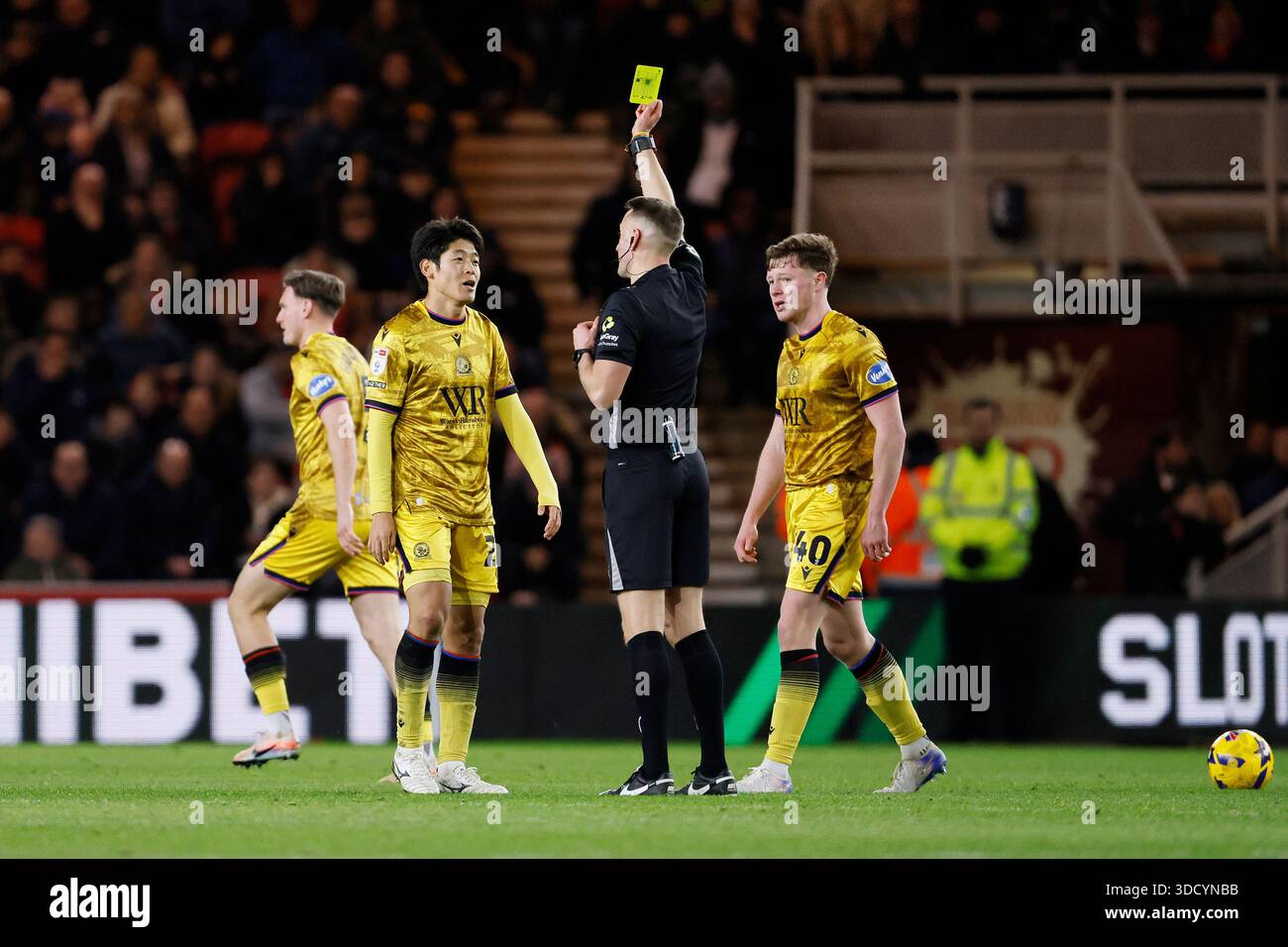 Blackburn Rovers' Yuki Ohashi (left) is shown a yellow card by Referee ...