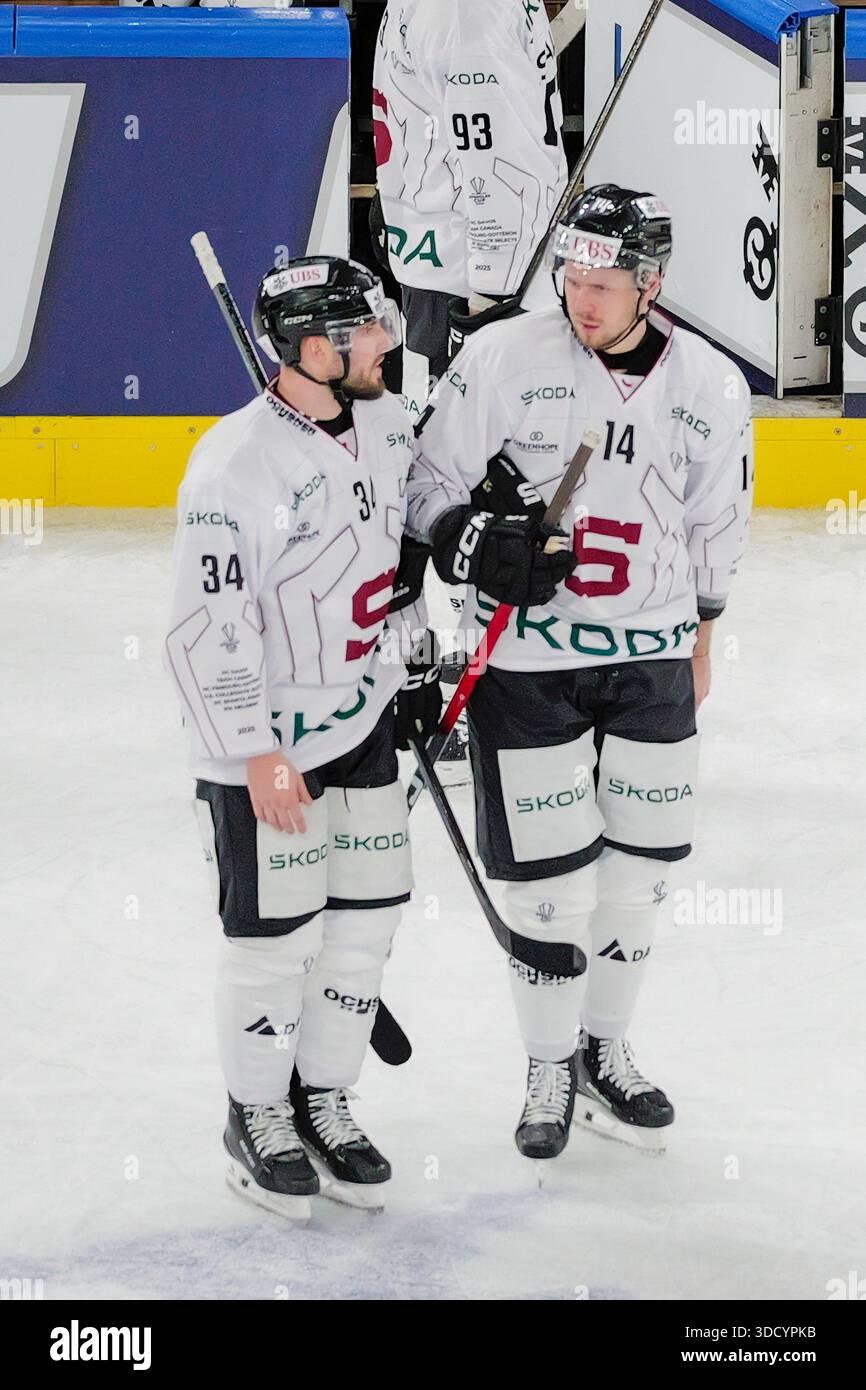 DAVOS, SWITZERLAND - DECEMBER 26: Michael Spacek of Sparta Praha L) and ...