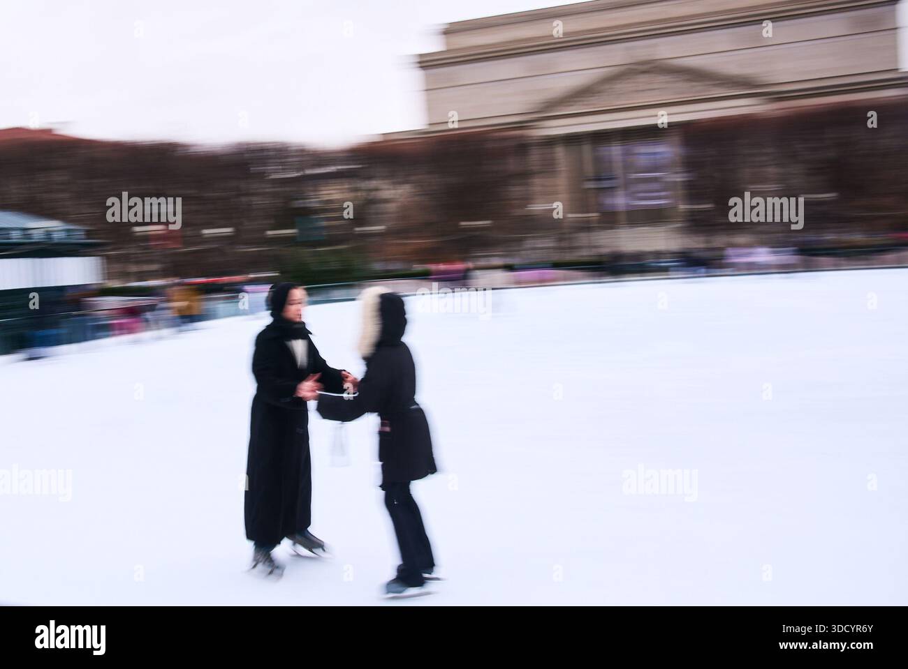 Two women skate together on the National Gallery of Art's Sculpture ...
