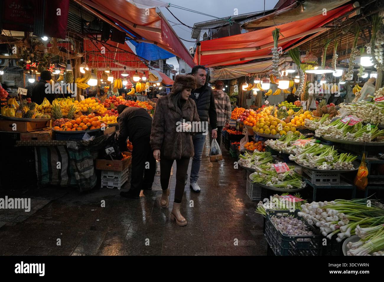 People shop in the old main bazaar of the northern city of Rasht, Iran ...