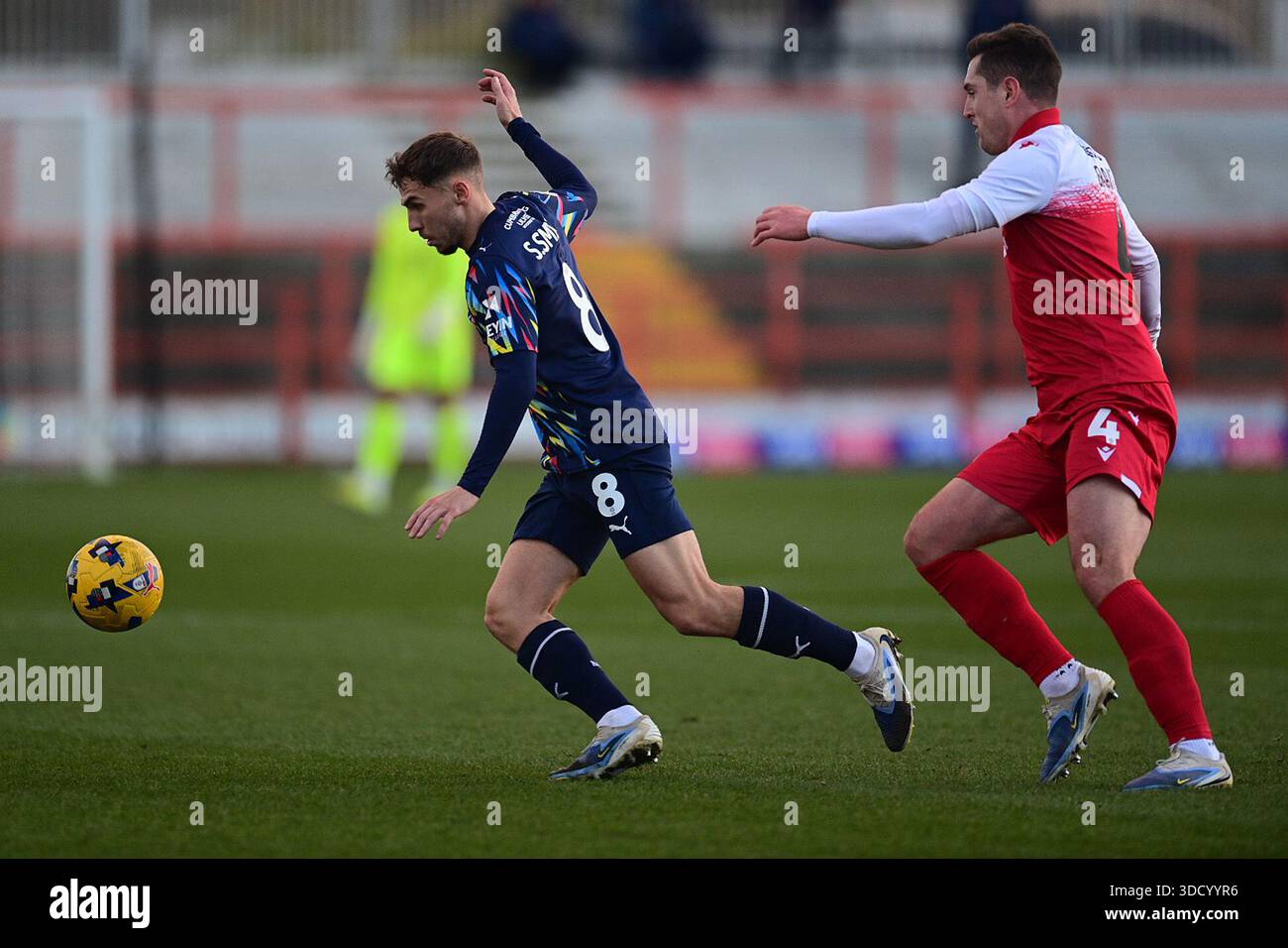 Barrow's Scott Smith in action with Accrington's Connor Grant during ...