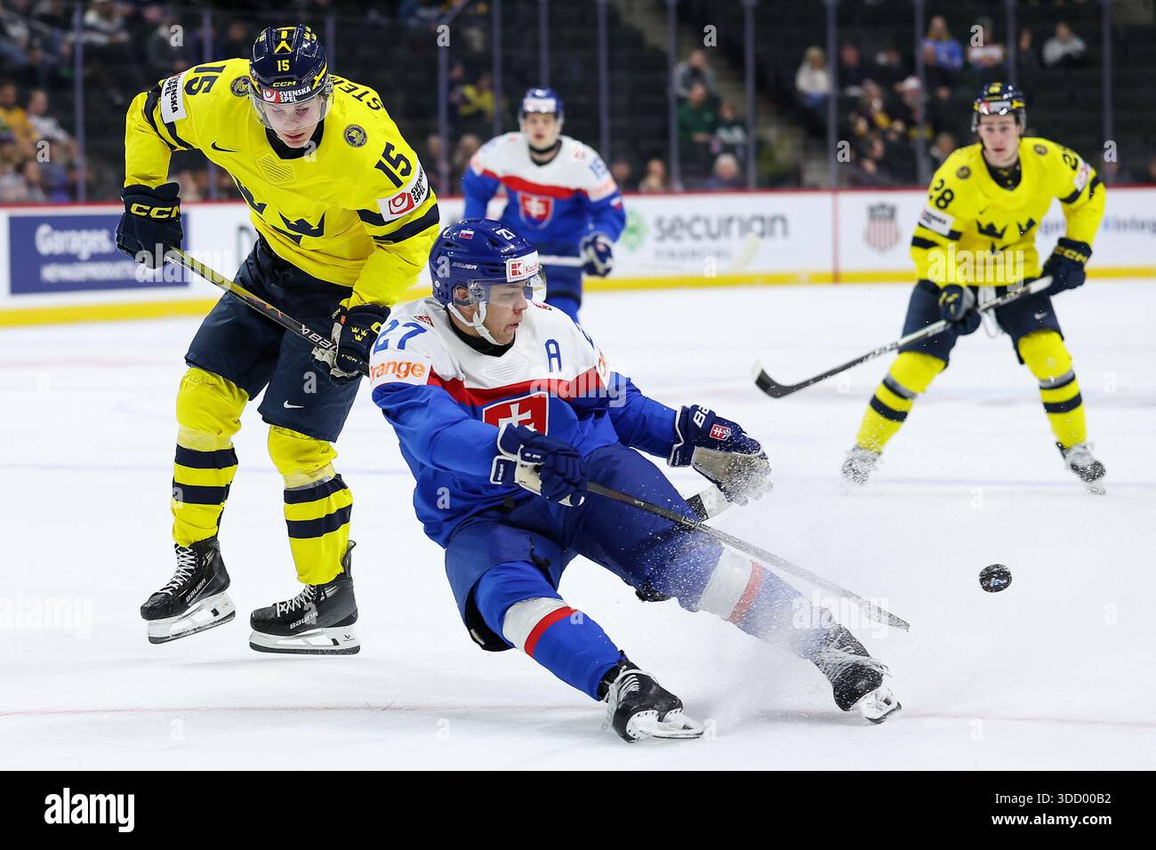 Slovakia defenseman Adam Belusko, front, and Sweden forward Ivar ...