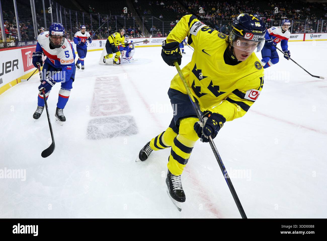 Sweden forward Ivar Stenberg (15) skates for the puck against Slovakia ...