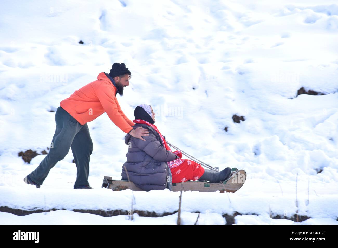 Tourist enjoy snow-clad fields and mountains following seasonal ...