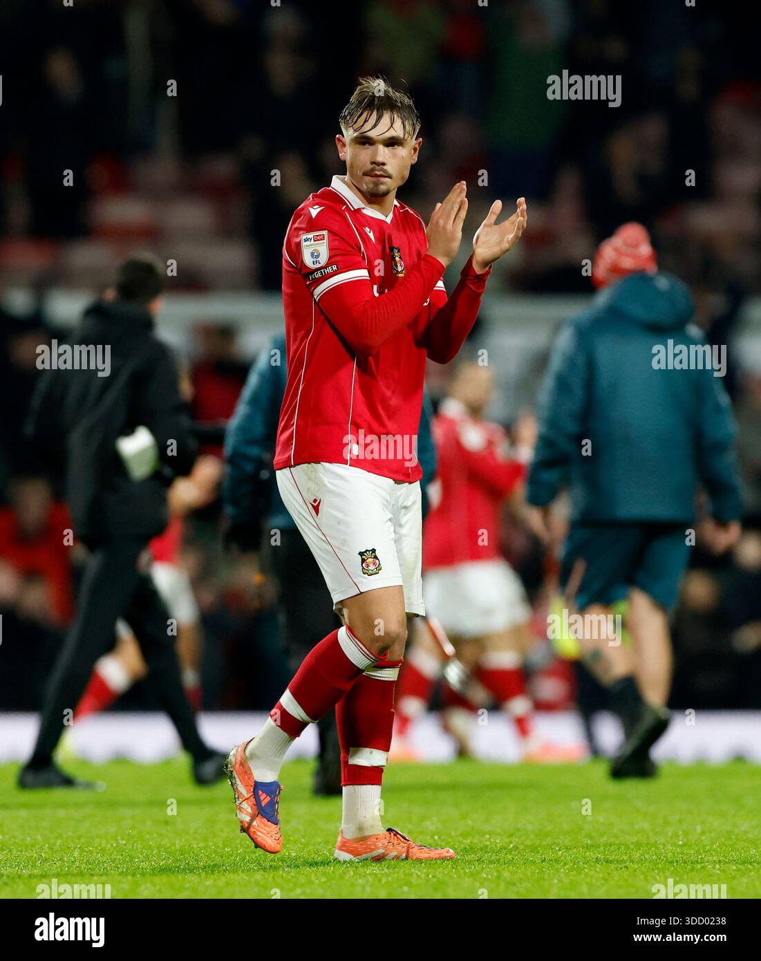Wrexham's Callum Doyle applauds the fans after the Sky Bet Championship ...