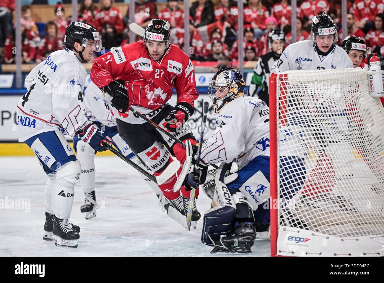 Team Canada's Derek Grant, middle, U.S. Collegiate Selects' Jake ...
