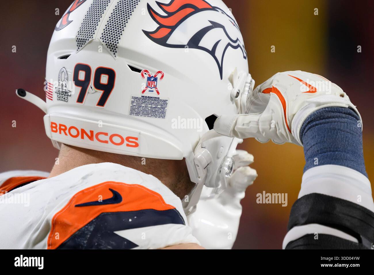 A candy cane decal is seen on the back of Denver Broncos defensive end ...